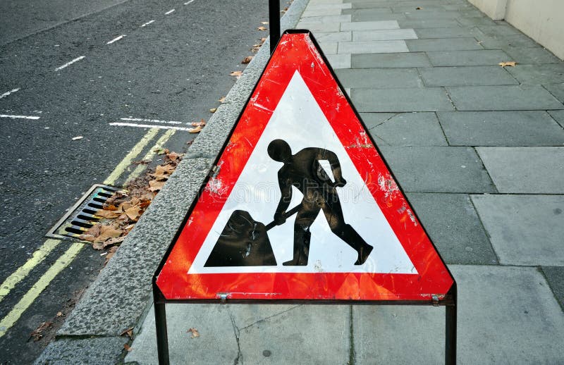 Red Triangular Construction Work Warning Traffic Sign in Front of ...