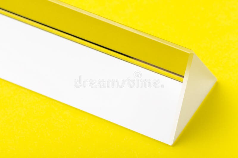Triangular Glass Prism on Yellow Background Stock Image - Image of ...