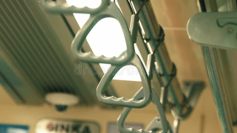Triangular Hand Grips in Subway Train Stock Footage - Video of light ...