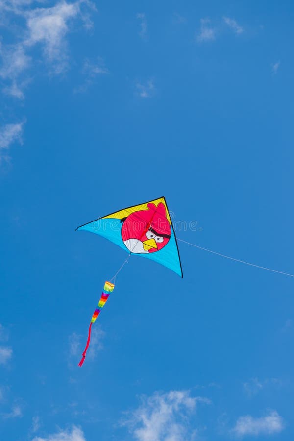 Triangular Kite with Multicolored Tail and the Image of a Round Red ...