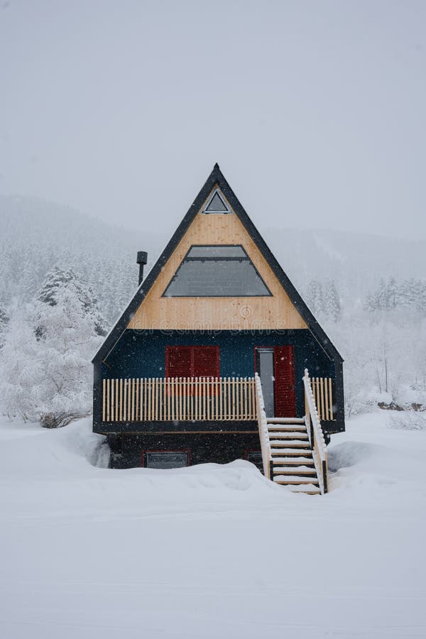 Triangular Modern Wooden House in Winter in the Snowy Mountains ...