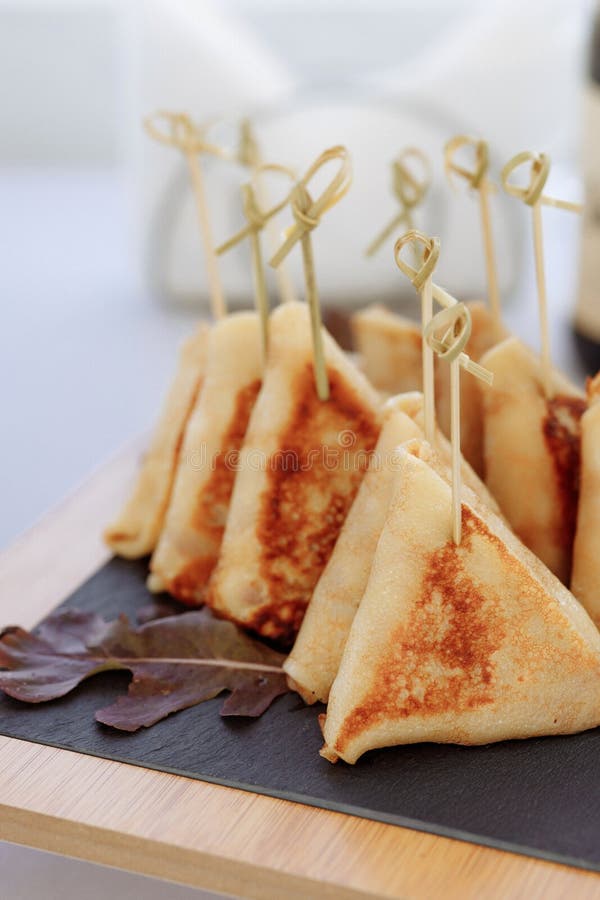 Triangular Pancakes with a Straw. Canapes. Stock Image - Image of ...