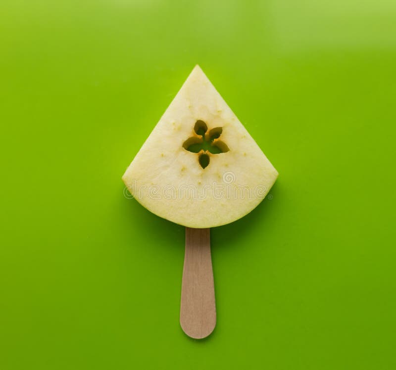 Triangular Piece of Apple on an Ice Cream Stick Stock Image - Image of ...