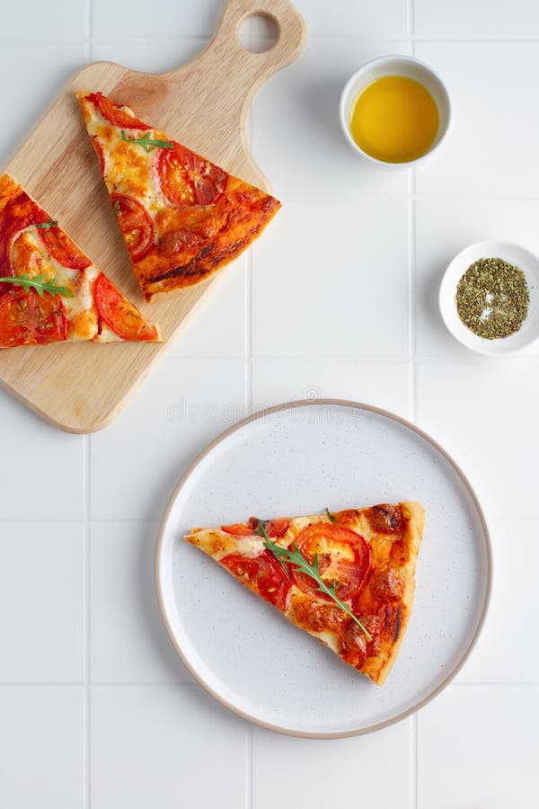 Triangular Pizza Slices on a Plate and Board Stock Image - Image of ...