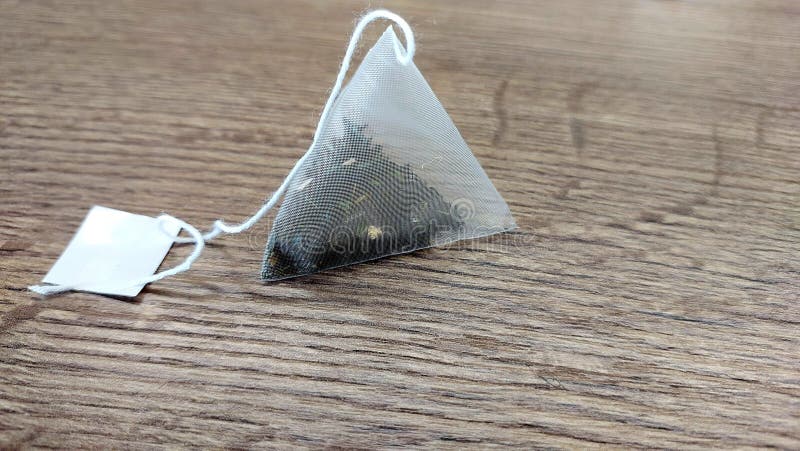 New Pyramid Tea Bag Isolated on White Stock Photo - Image of rope ...