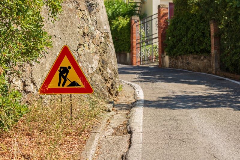 Triangular Road Sign of Men at Work or Work in Progress Sign Stock ...