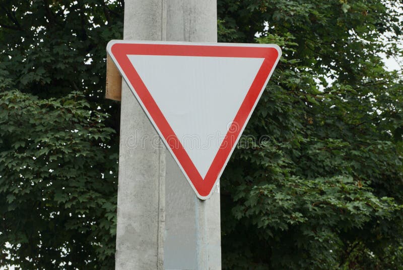 Triangular Road Sign on a Pillar Give Way Stock Photo - Image of ...
