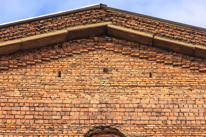 Triangular Roof of an Old Building of Orange Bricks Against a Blue Sky ...