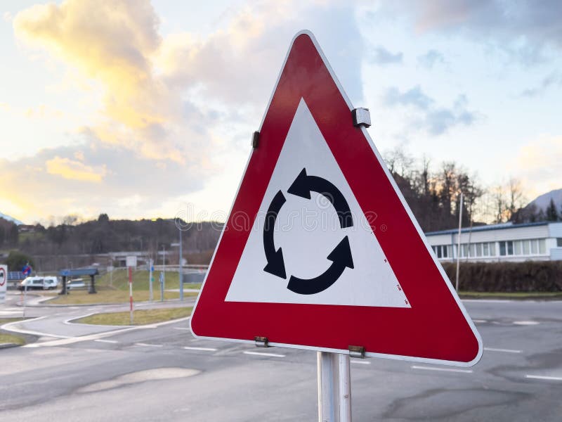 Triangular Roundabout Sign at Suburban Intersection at Sunset Stock ...