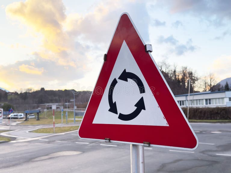 Triangular Roundabout Sign at Suburban Intersection at Sunset Stock ...
