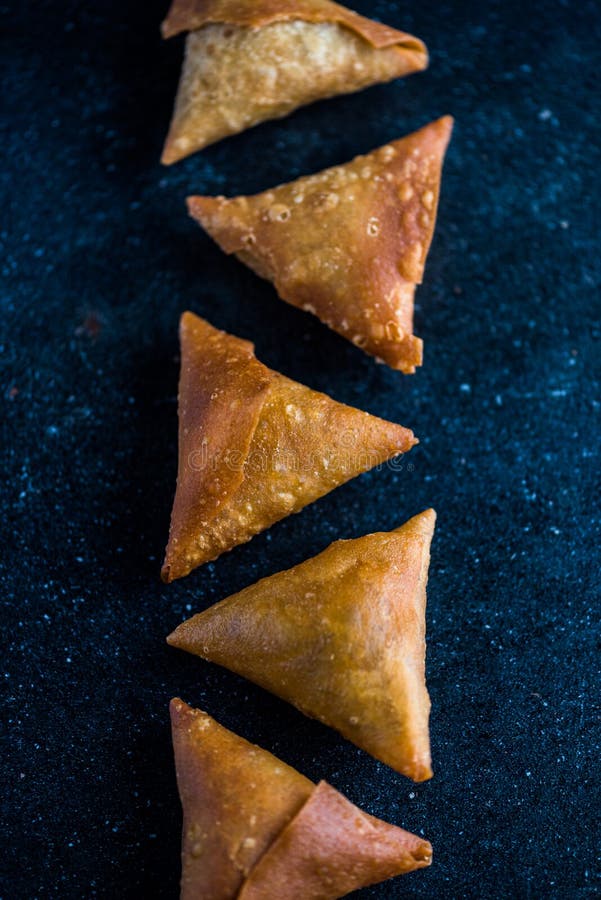 Triangular Samosas on a Blue Glossy Surface Stock Photo - Image of ...