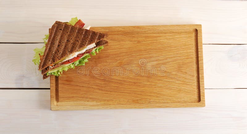 Triangular Sandwich on a Wooden Board Stock Photo - Image of tasty ...