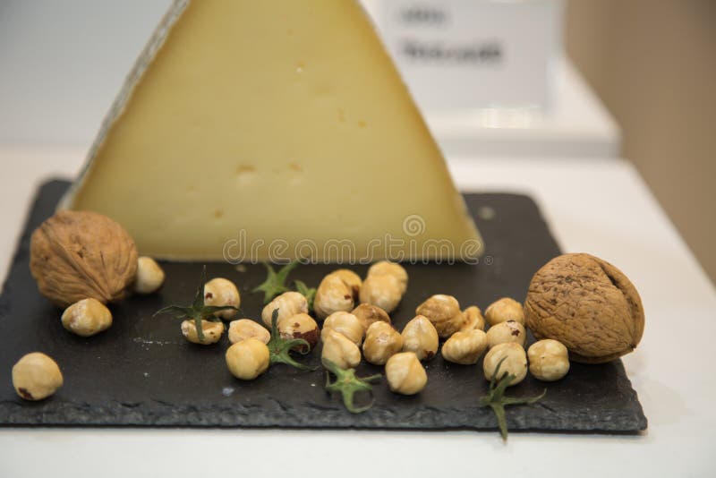 Triangular-shaped Cheese on Black Tablecloth with Raw Chickpeas and Big ...