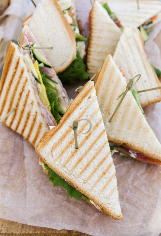 Triangular Shaped Sandwich with Ham, Vegetables and Mayonnaise on a ...