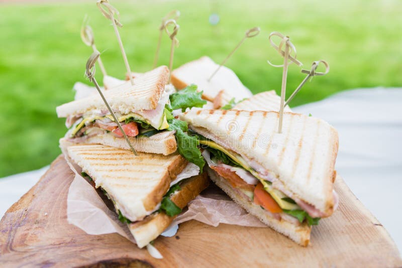 Triangular Shaped Sandwich with Ham, Vegetables and Mayonnaise on a ...