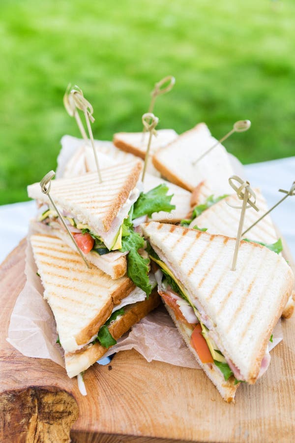 Triangular Shaped Sandwich with Ham, Vegetables and Mayonnaise on a ...