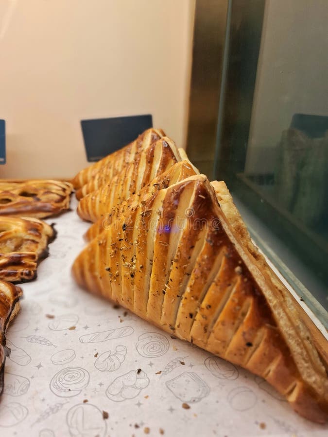The Triangular-shaped Tuna Puff Cake Arranged in a Glass Display Case ...