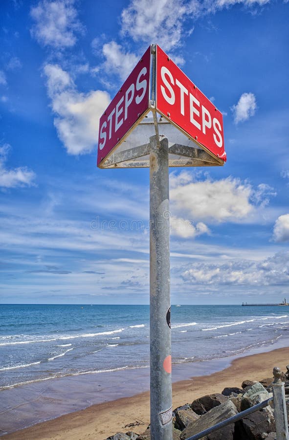 Triangular Sign To Mark Where Steps are on a Beach. West Cliff Beach ...