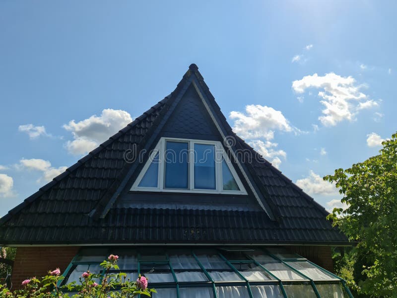 Triangular Skylight Window Illuminating Attic Room Under Black Rooftop ...