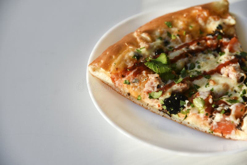 Triangular Slice of Pizza on a White Plate Stock Image - Image of ...