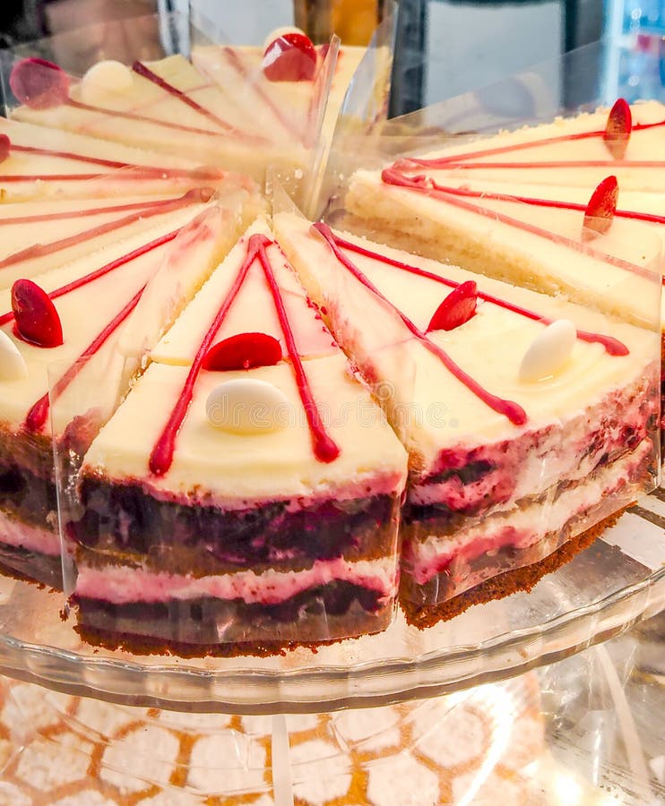 Triangular Slices of Cherry Cake Drizzled with White Chocolate ...