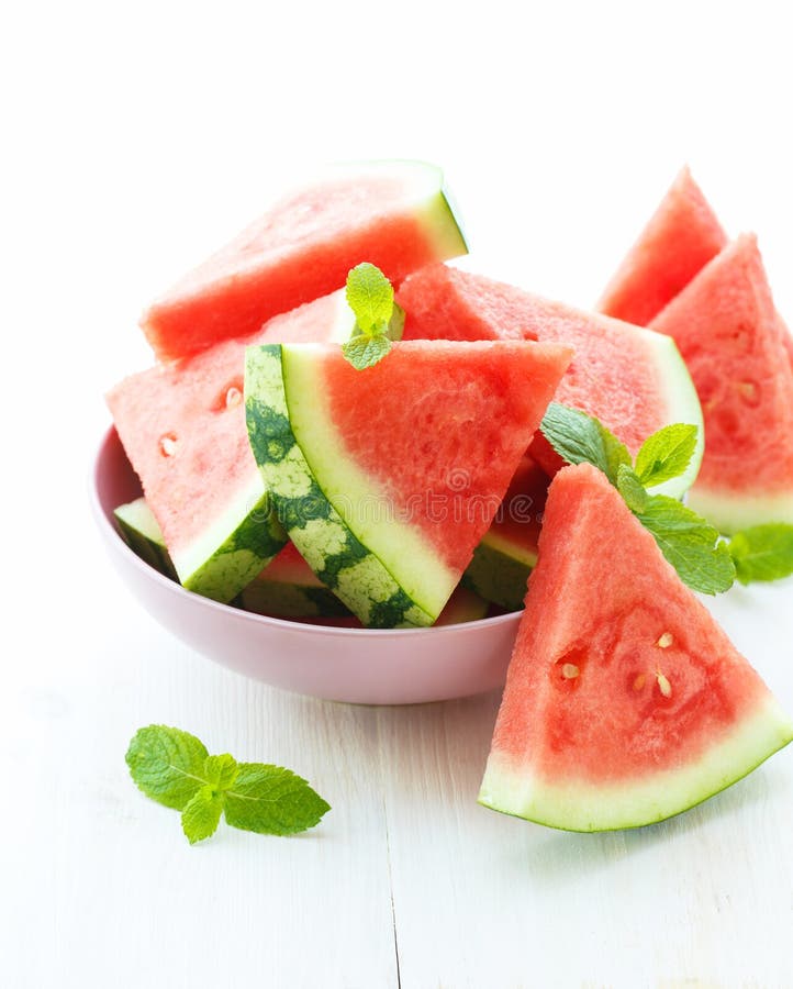 Triangular Slices of Fresh Watermelon on White Wooden Background Stock ...