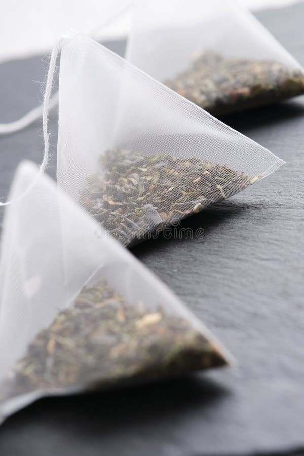 Triangular Teabag with Tea on a Slate. Stock Image - Image of unused ...