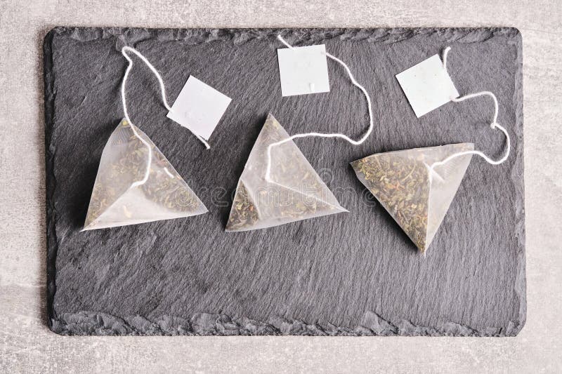 Triangular Teabag with Tea on a Slate. Stock Image - Image of herbal ...