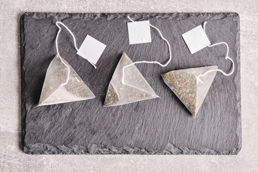 Triangular Teabag with Tea on a Slate. Stock Image - Image of herbal ...
