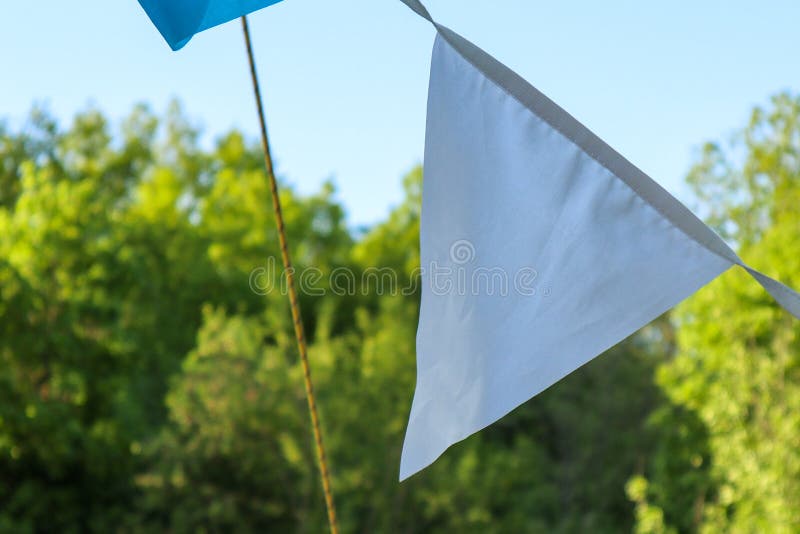 Triangular White Flag on the Stretch Close-up. Stock Photo - Image of ...
