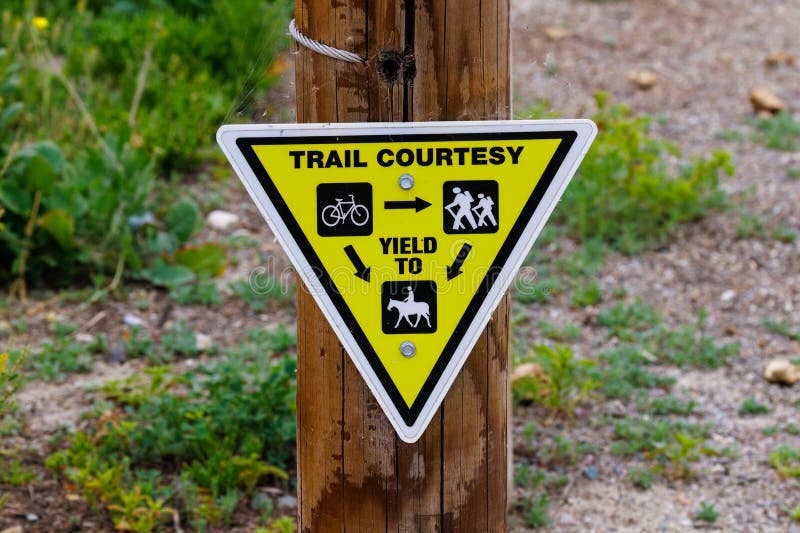 Triangular Yellow Trail Courtesy Sign Stock Image - Image of wood ...