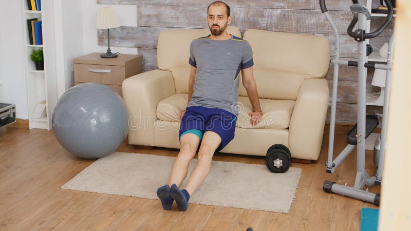 Triceps workout on couch stock photo. Image of indoor - 187732092