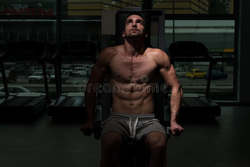 Triceps Workout on Machine stock image. Image of model - 64101847
