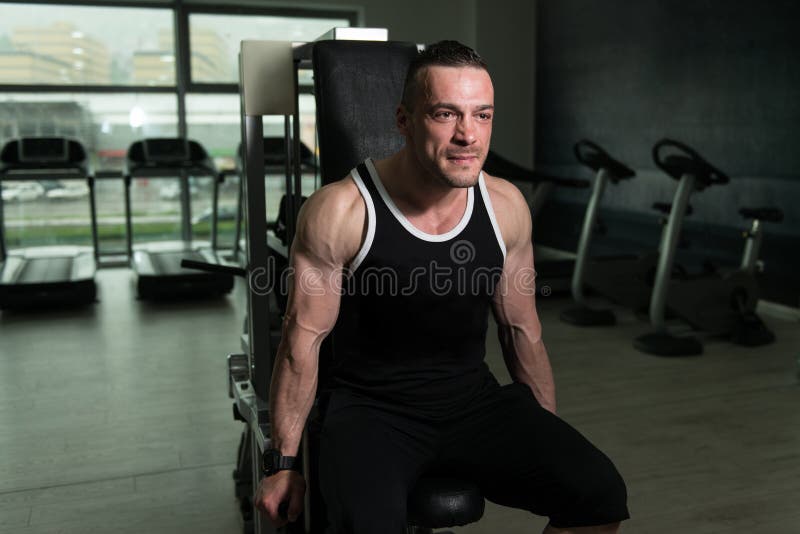 Triceps Workout on Machine stock image. Image of athlete - 76032809