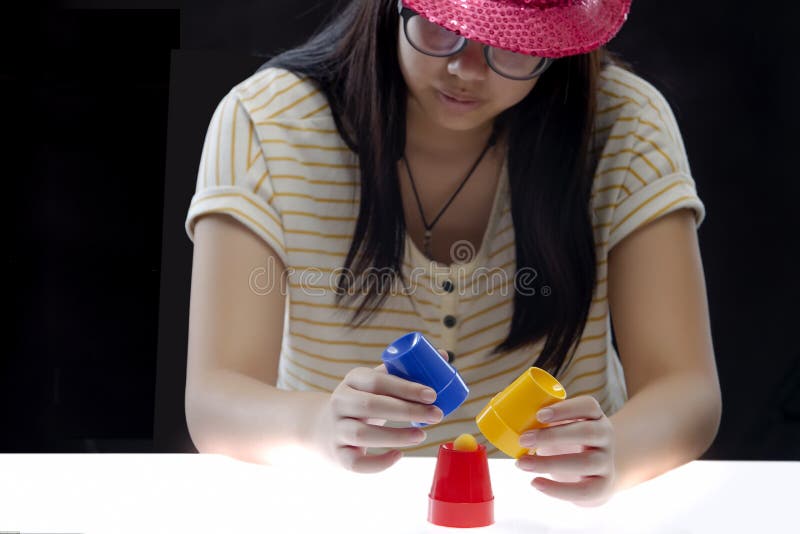 Trick with three cups stock image. Image of magician - 54315487