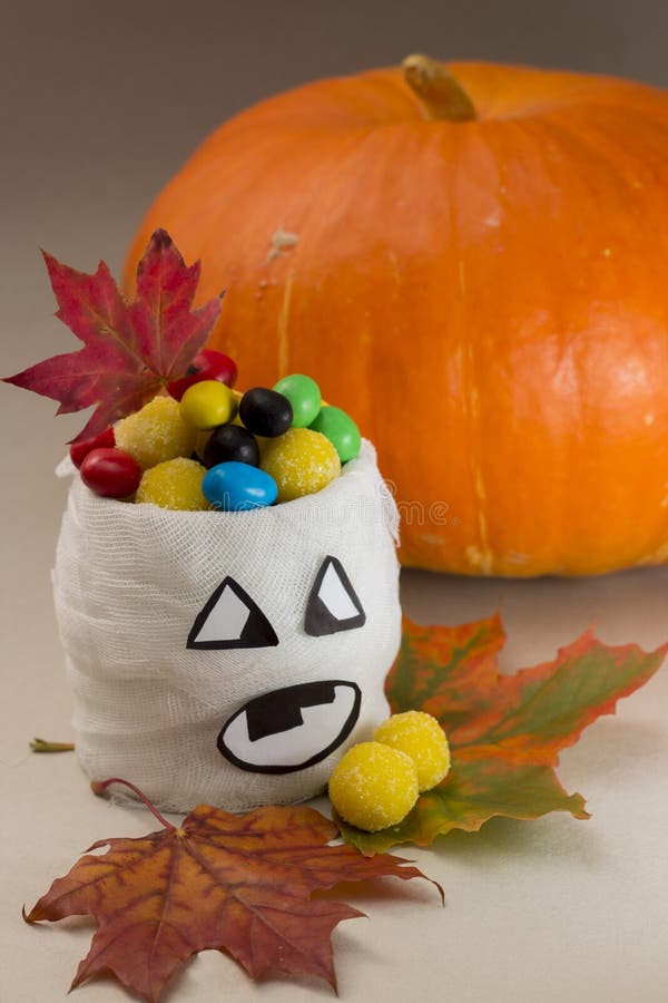 Trick-or-treating. Funny Mummy-cup with Candies Stock Image - Image of ...
