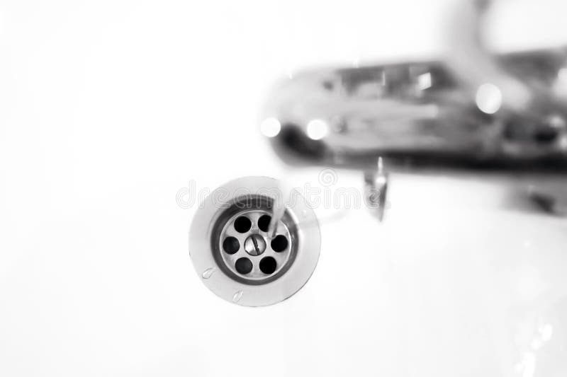 Trickle of Water Running into Bathroom Sink from a Stainless Tap Stock ...