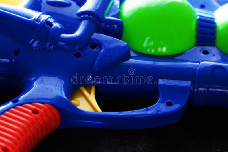 Trigger for a Blue Plastic Water Gun Stock Image - Image of plastic ...
