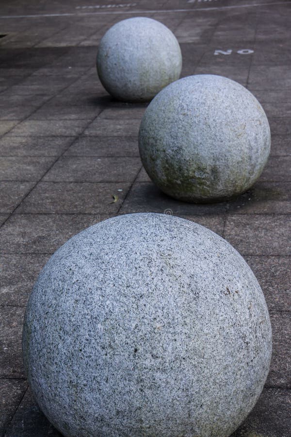 Trio of stone spheres stock photo. Image of street, circular - 133184442