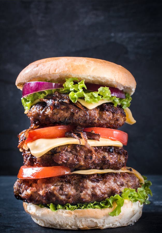 Triple burger stock image. Image of sesame, rustic, beef - 53199653