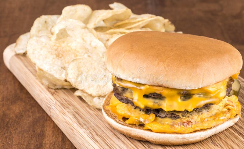 Big Triple Cheeseburger stock photo. Image of junkfood - 38308120