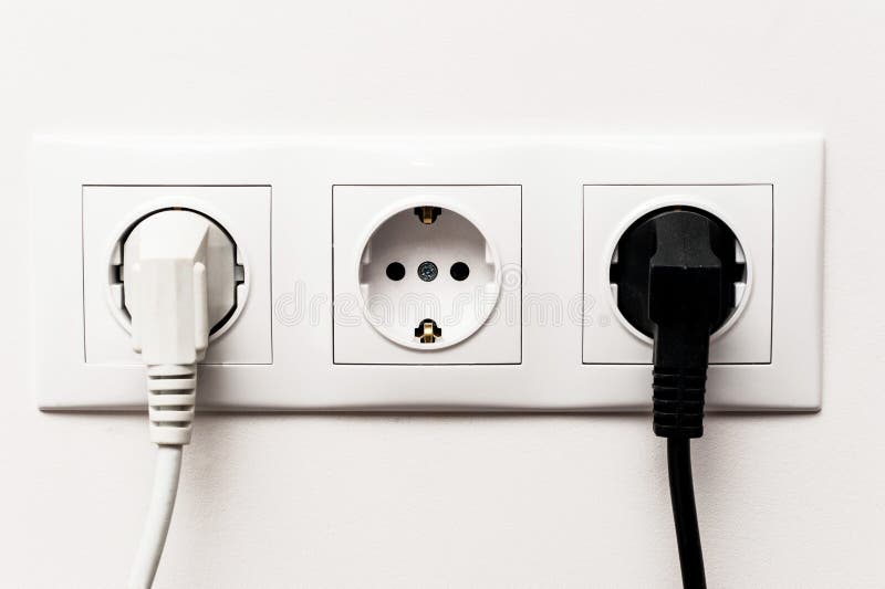 Triple Electrical Socket with Two Plugged Cables Stock Photo - Image of ...