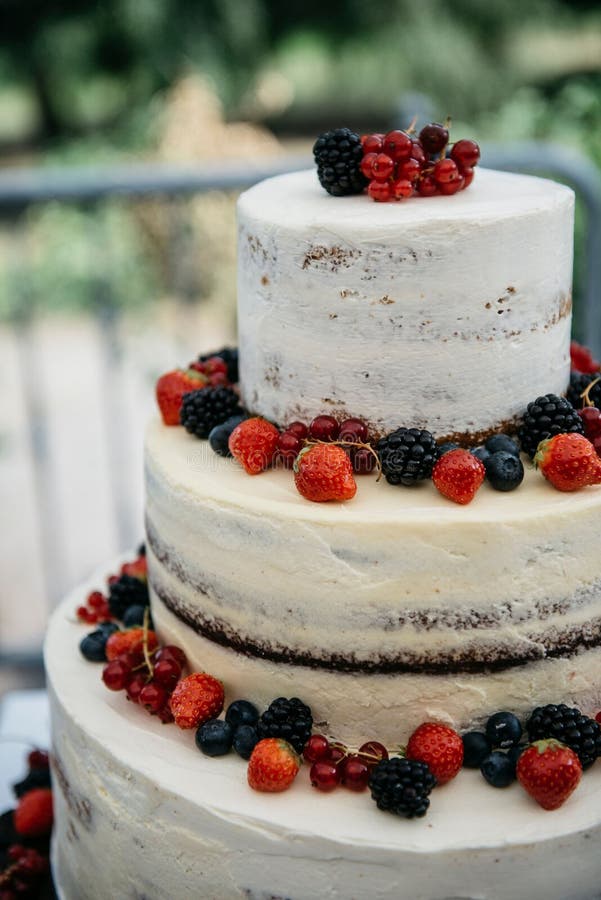 Triple-layer Cake Adorned with Assorted Berries Stock Photo - Image of ...