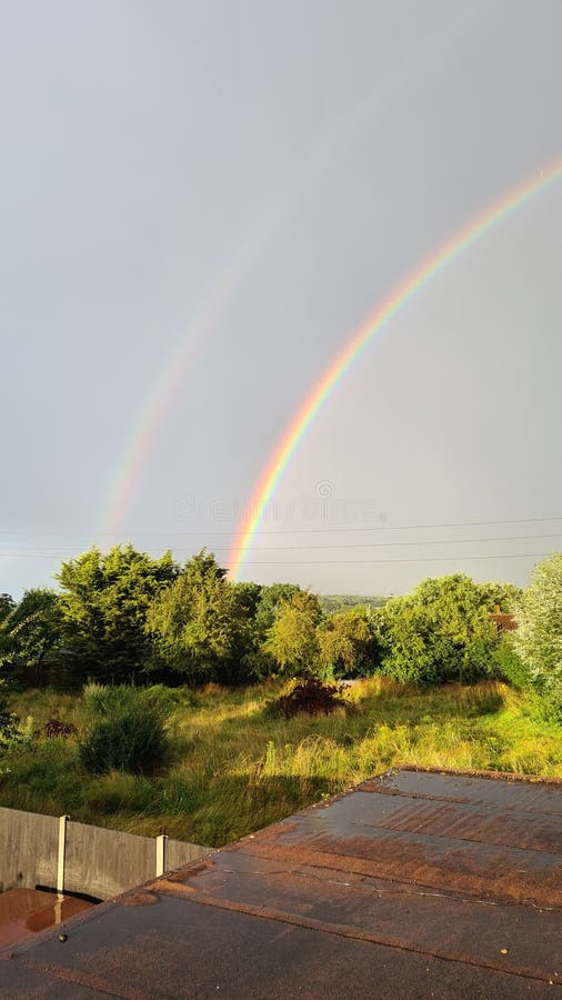 Triple rainbow - LDN stock image. Image of tree, sunlight - 244653005