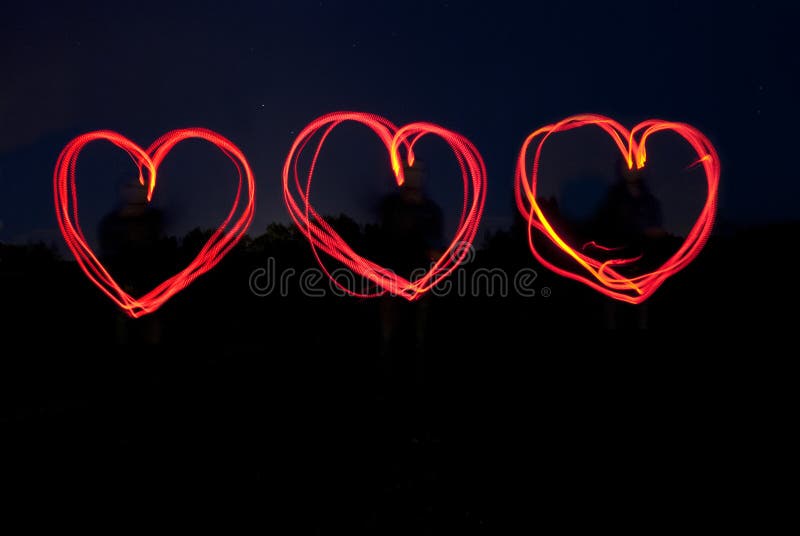 Triple Red Hearts Shining in the Night. Stock Image - Image of mothers ...