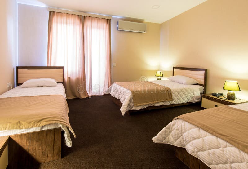 Triple Room in Modern Hotel Stock Photo - Image of indoors ...