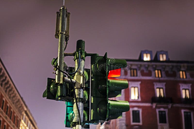 Triple Traffic Light at the Intersection with Red and Green Lights in ...