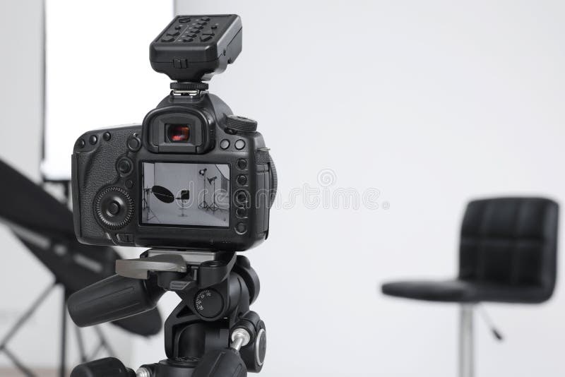 Tripod with Camera, Bar Stool and Professional Lighting Equipment in ...