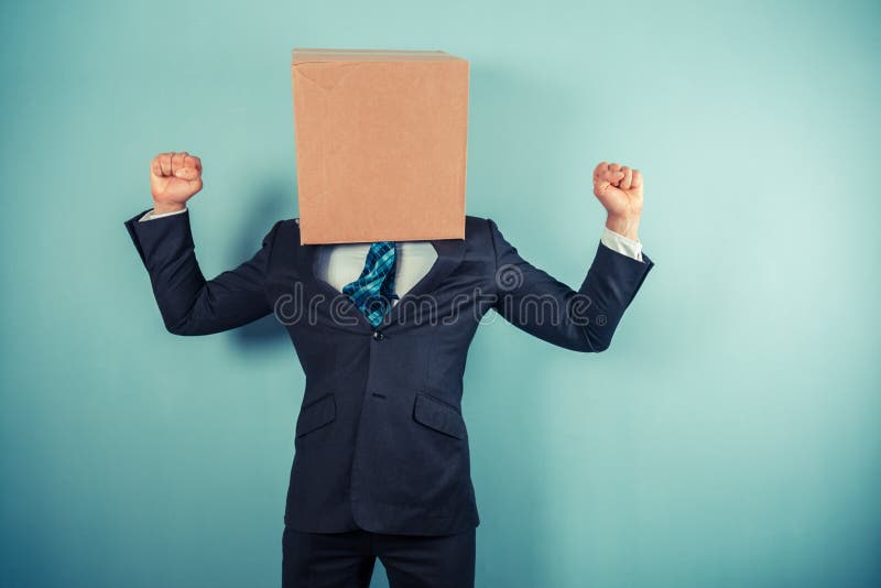 Triumphant Businessman with Box on Head Stock Photo - Image of think ...