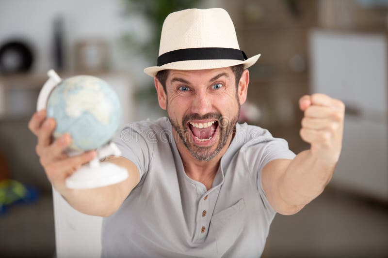 Triumphant Man Holding Globe Stock Image - Image of globe, people ...